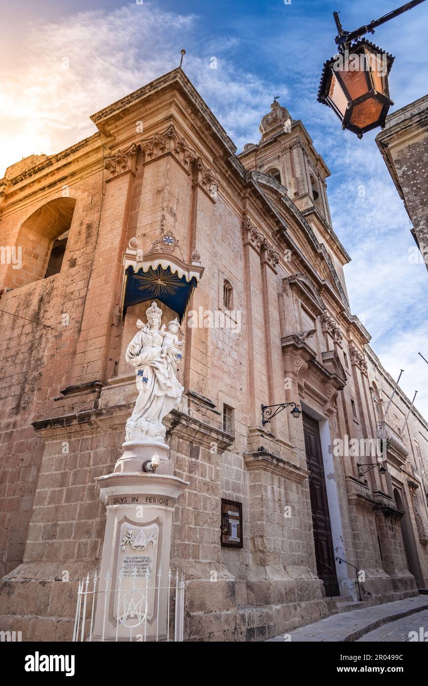 A view of old Mdina street with a traditional Maltese style openwork ...