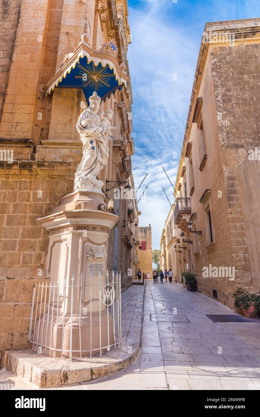 A view of old Mdina street with a traditional Maltese style openwork ...