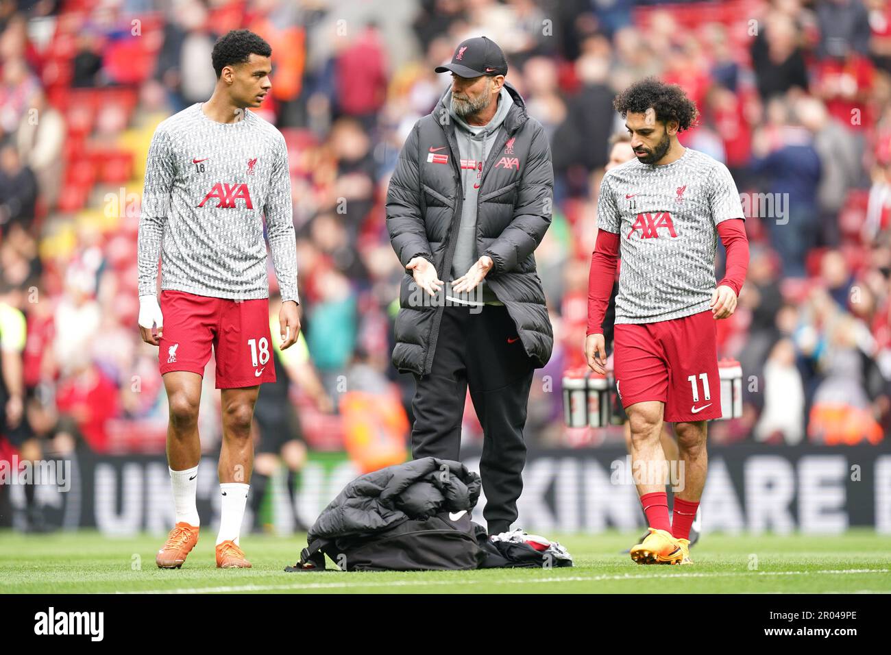Liverpool manager Jurgen Klopp (centre) with players Liverpool's Cody ...