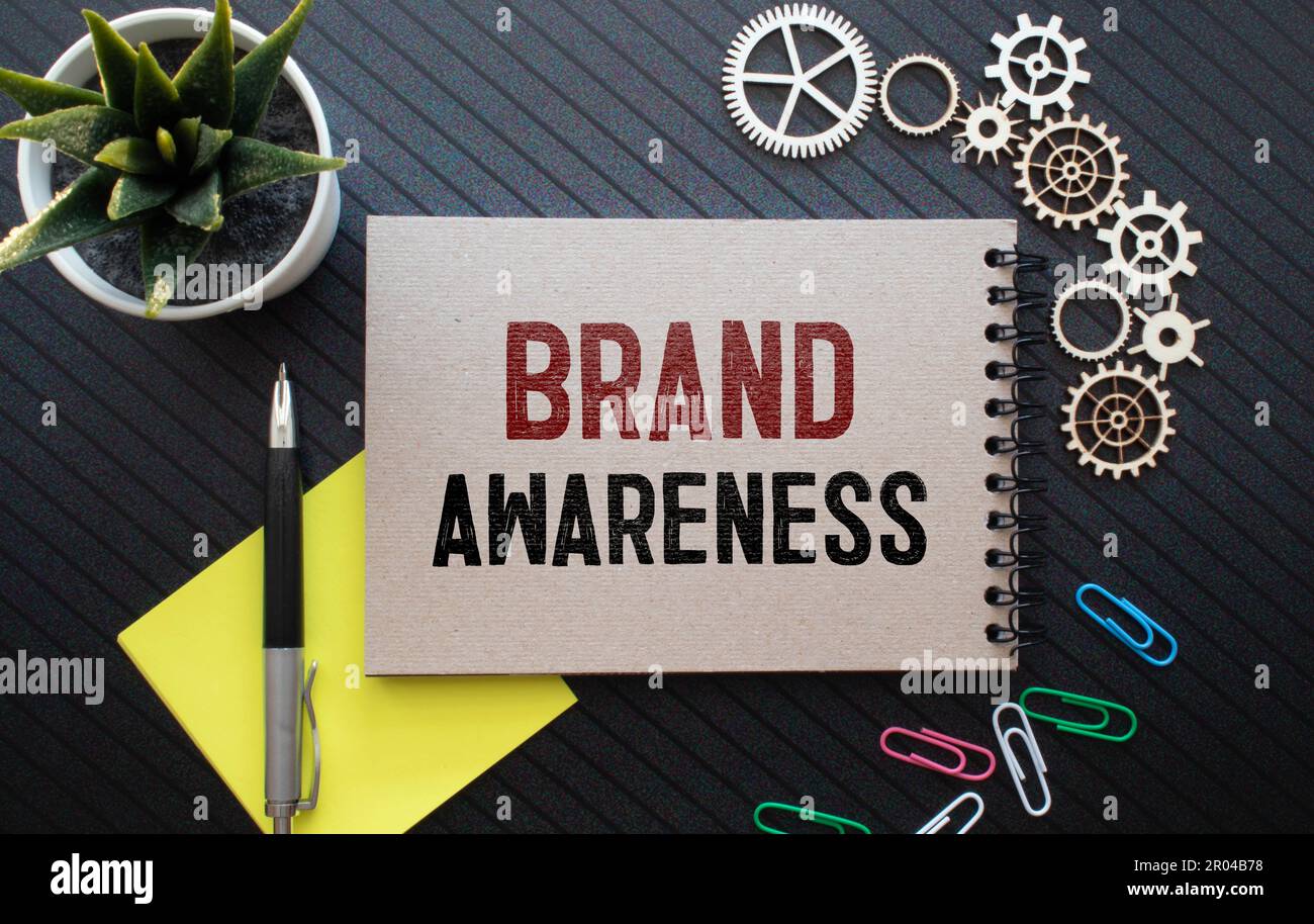 Brand awareness inscription sign on notebook with keyboard and coffee ...