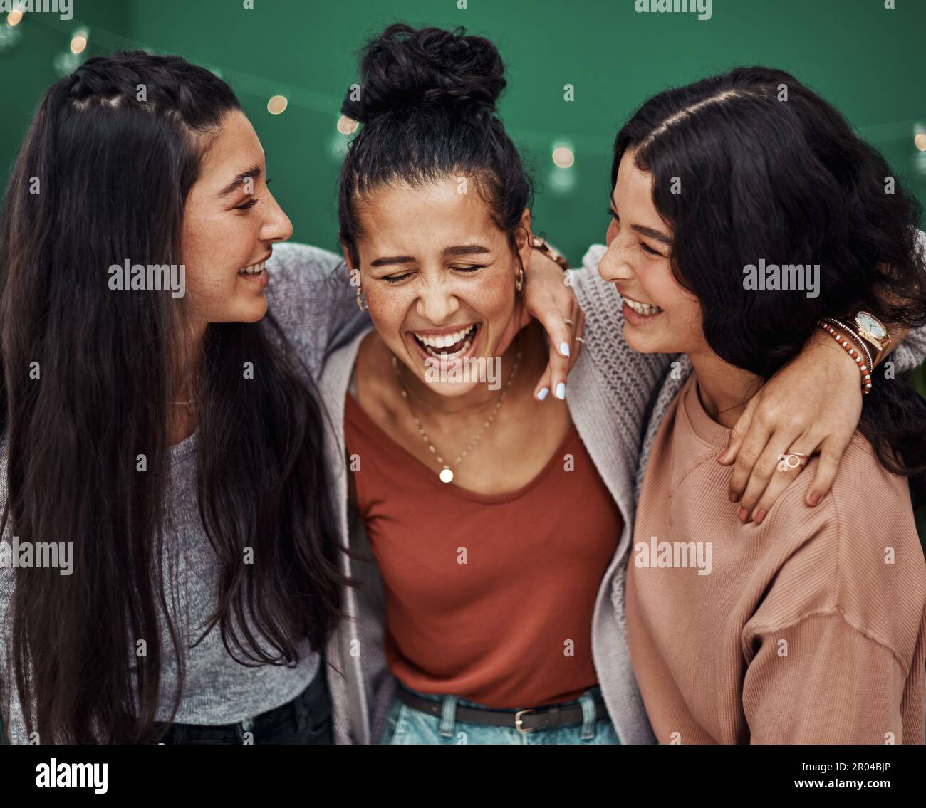 Our sisters are our soul mates. three happy young sisters embracing at ...