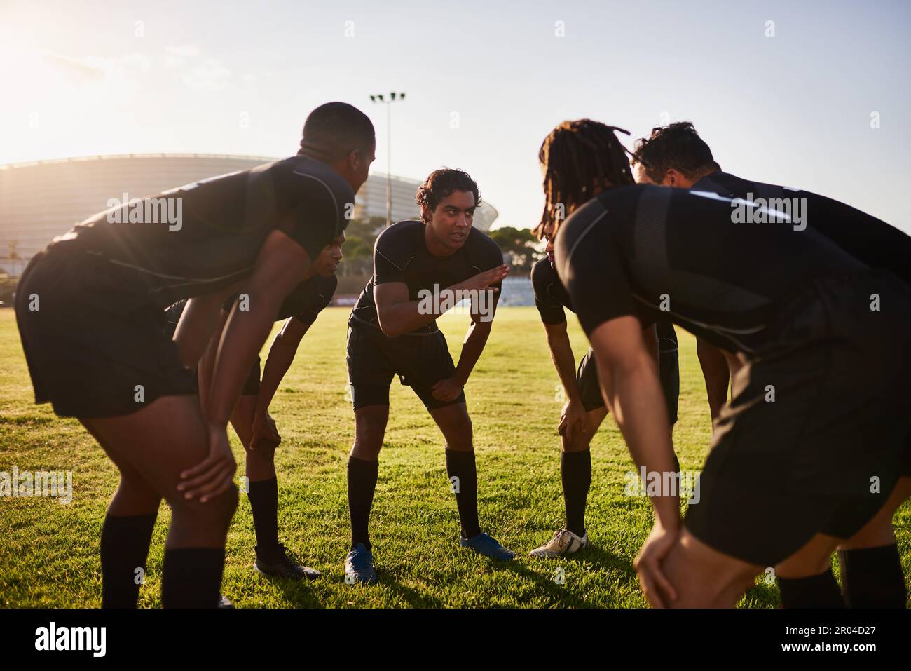How are we going to win. a diverse group of sportsmen huddled together ...