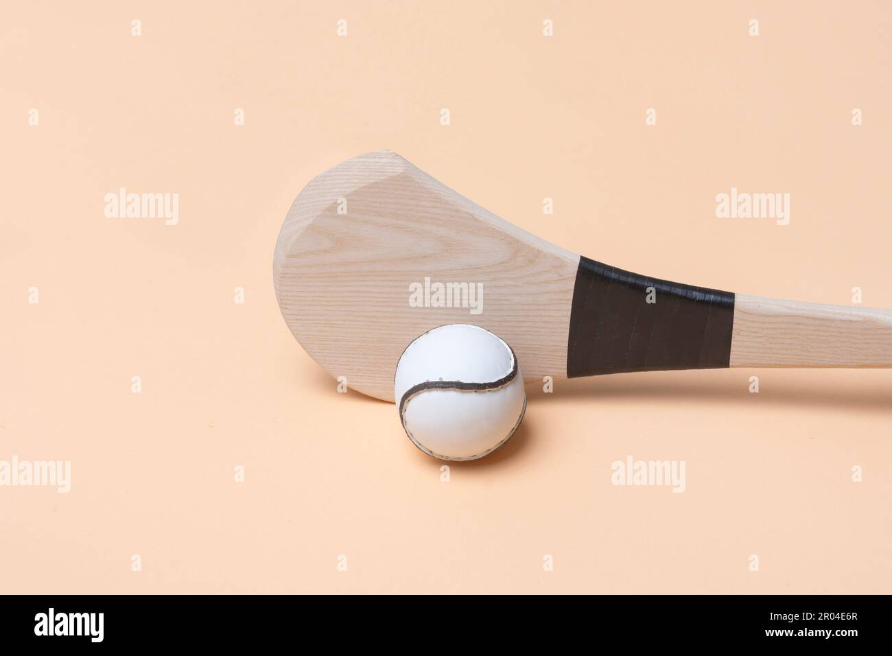 Hurling bat and sloitar on beige background. Horizontal sport theme ...