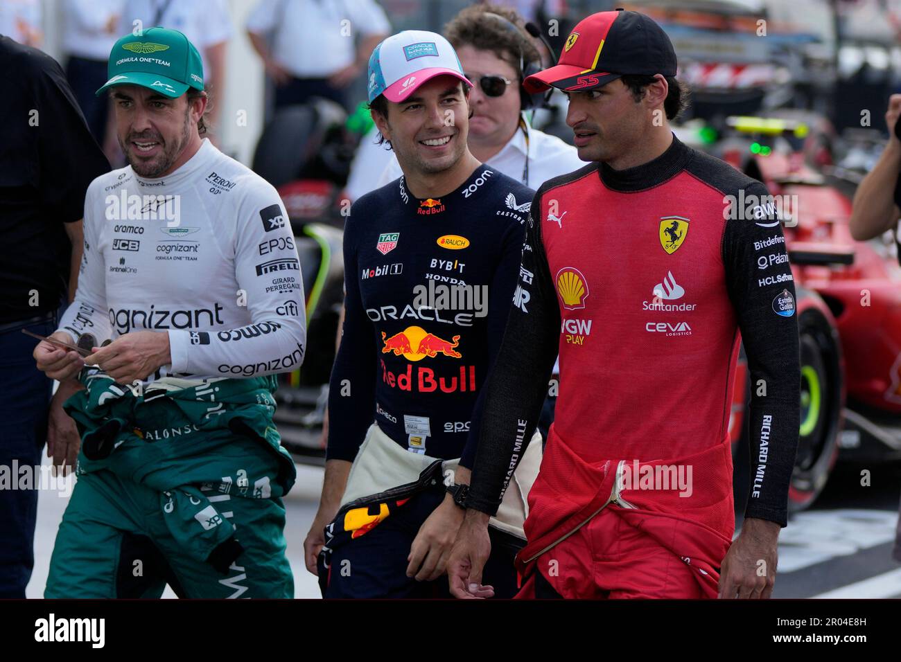 First place finisher, Red Bull driver Sergio Perez of Mexico, center ...