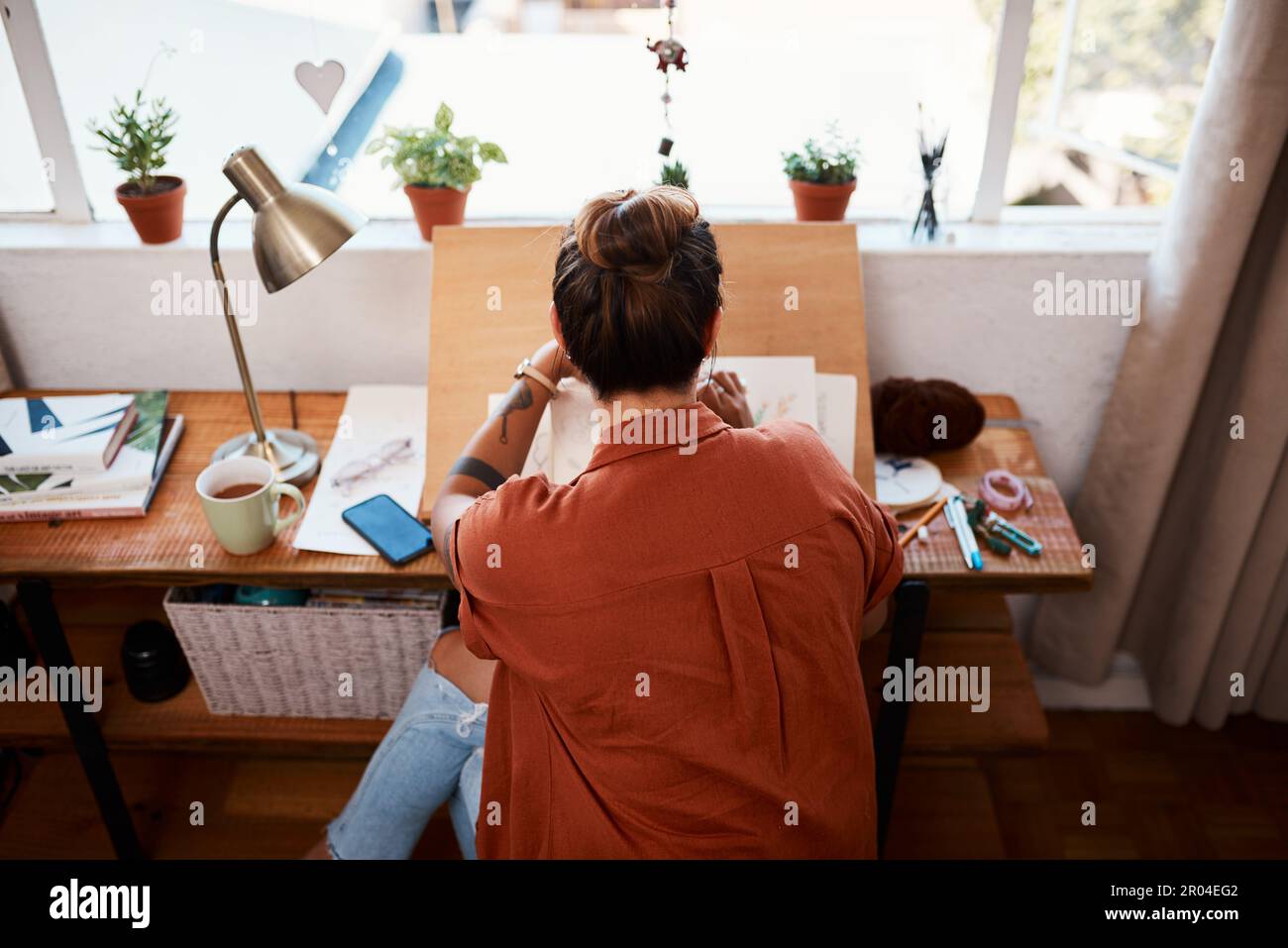 I cant imagine a life without art. a young woman sketching at home ...