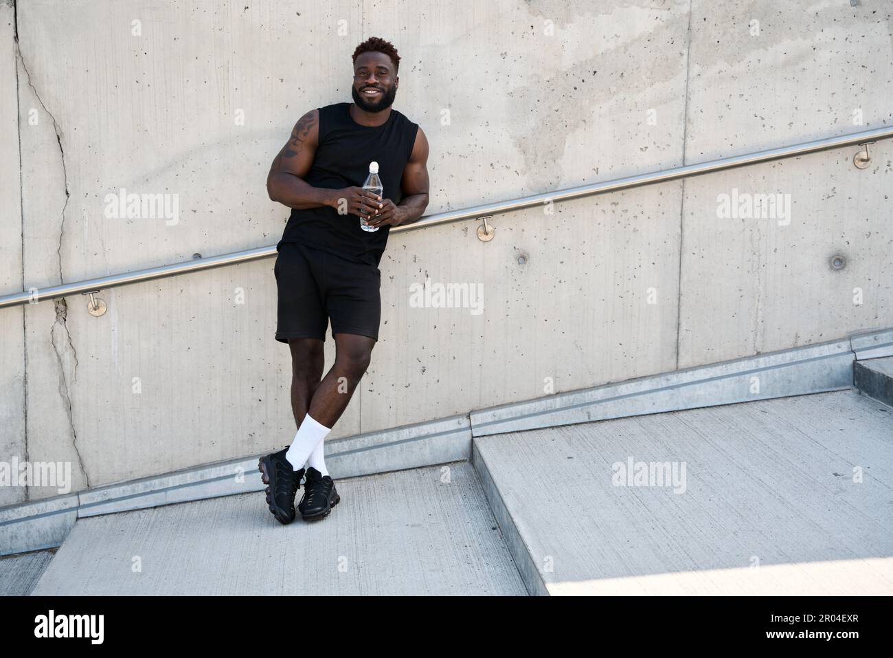 Young black man standing outside hi-res stock photography and images ...