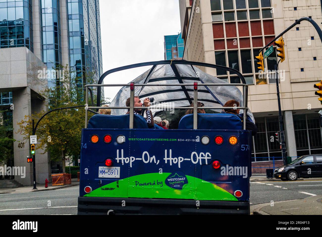 Th Hop on Hop off bus on a moist day in Vancouver British Columbia ...
