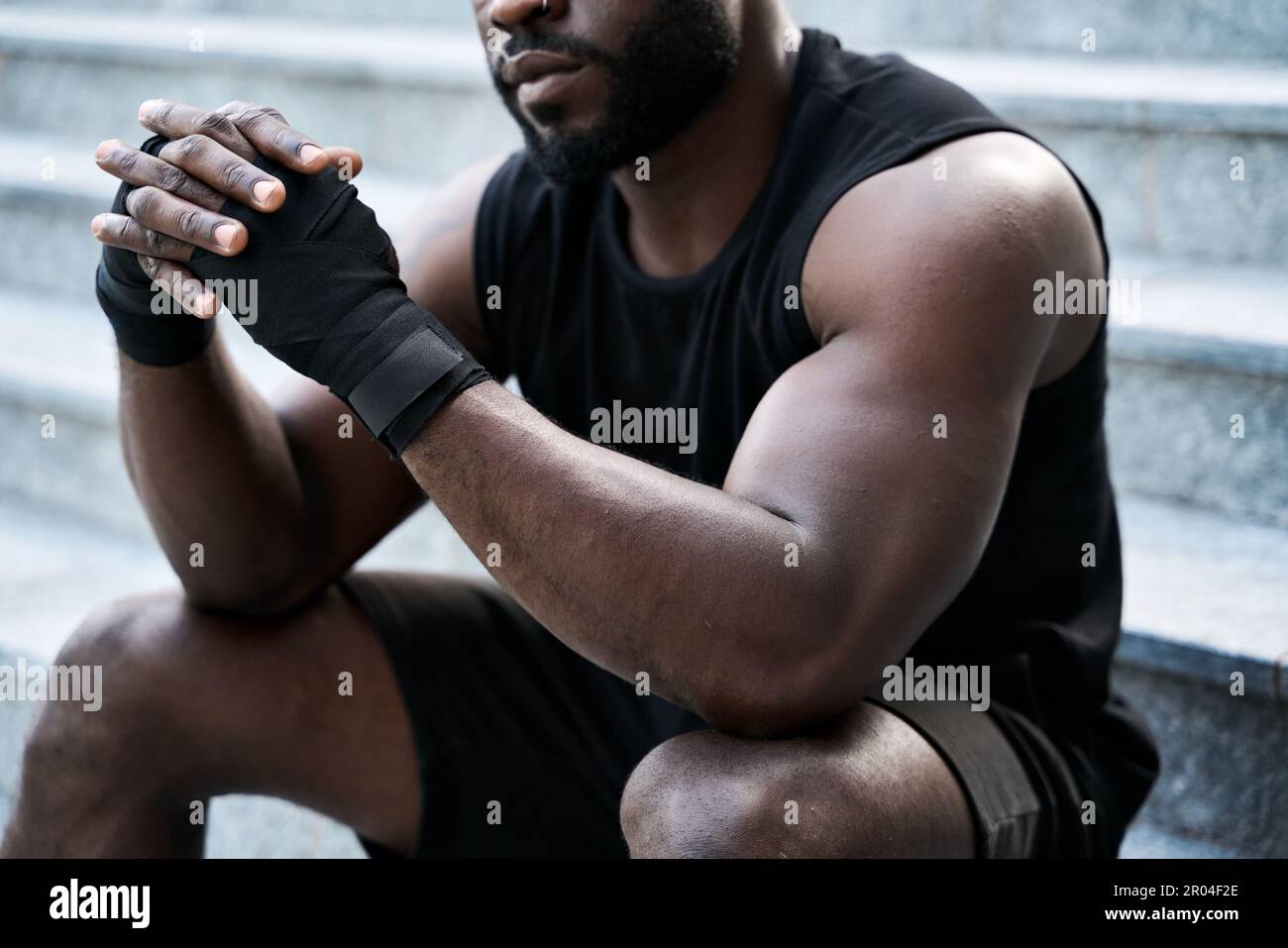 Fit confident sporty young black man boxer fighter sitting outdoors ...