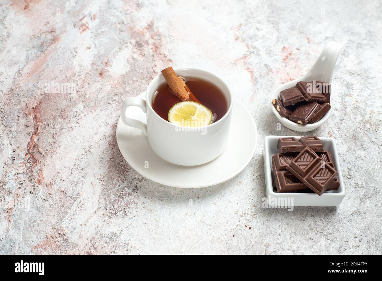 front view cup of tea with chocolate on light background dessert tea ...
