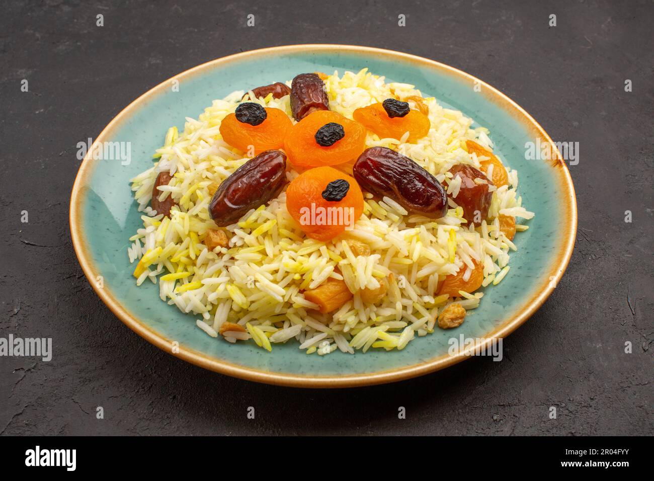 front view delicious cooked plov rice with different raisins inside ...
