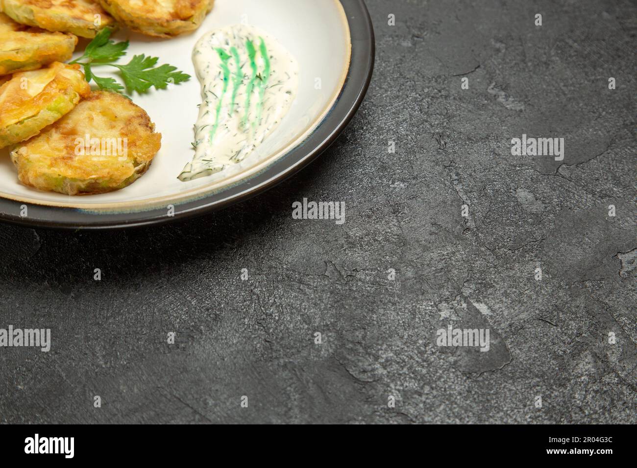 front view delicious cooked squashes slices inside plate on grey ...