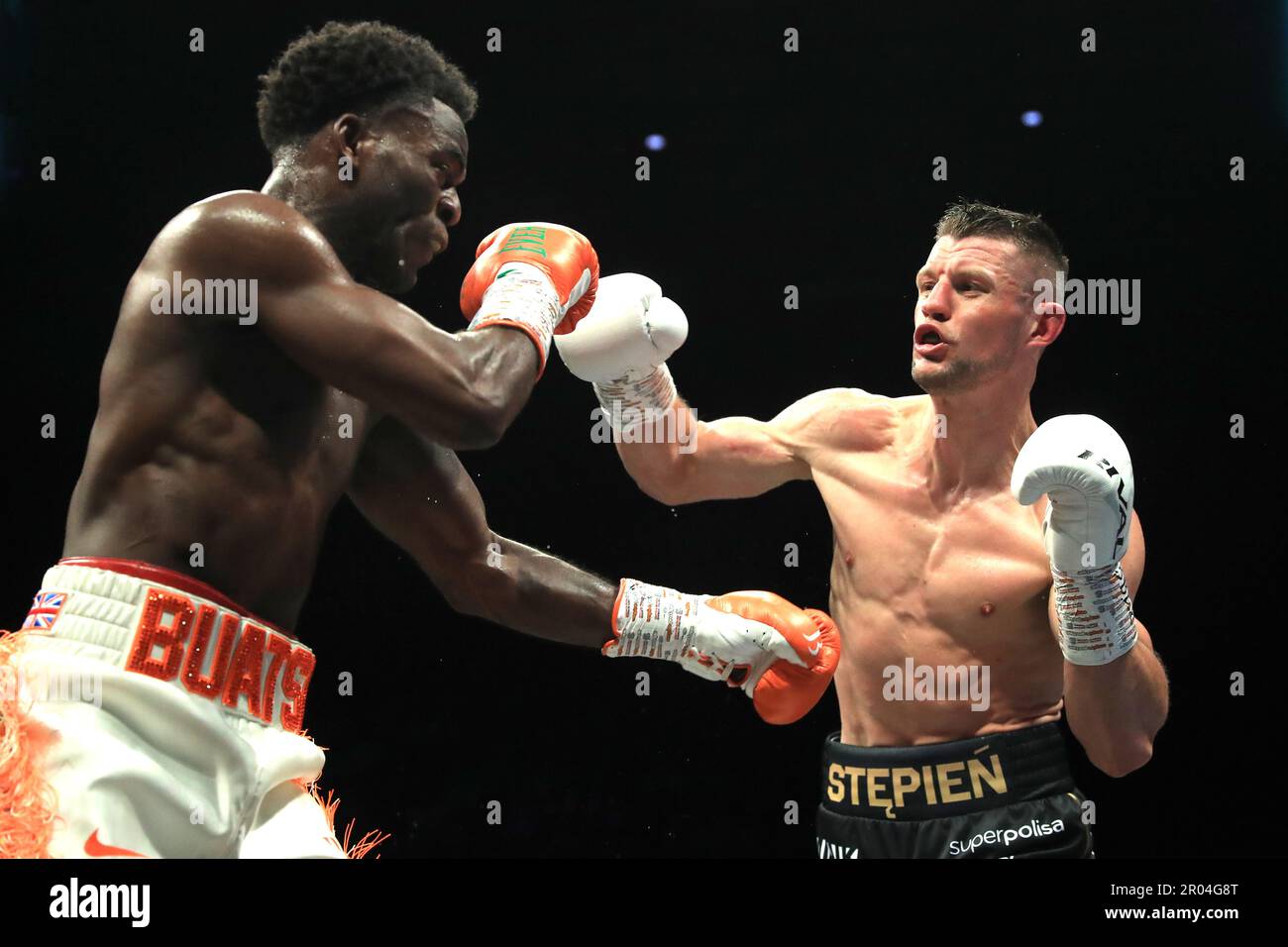 Pawel Stepien (right) in action against Joshua Buatsi in the light ...