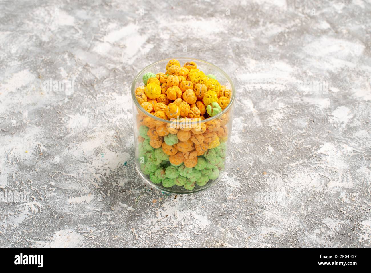 front view sugar candies inside glass on white background candy tea ...