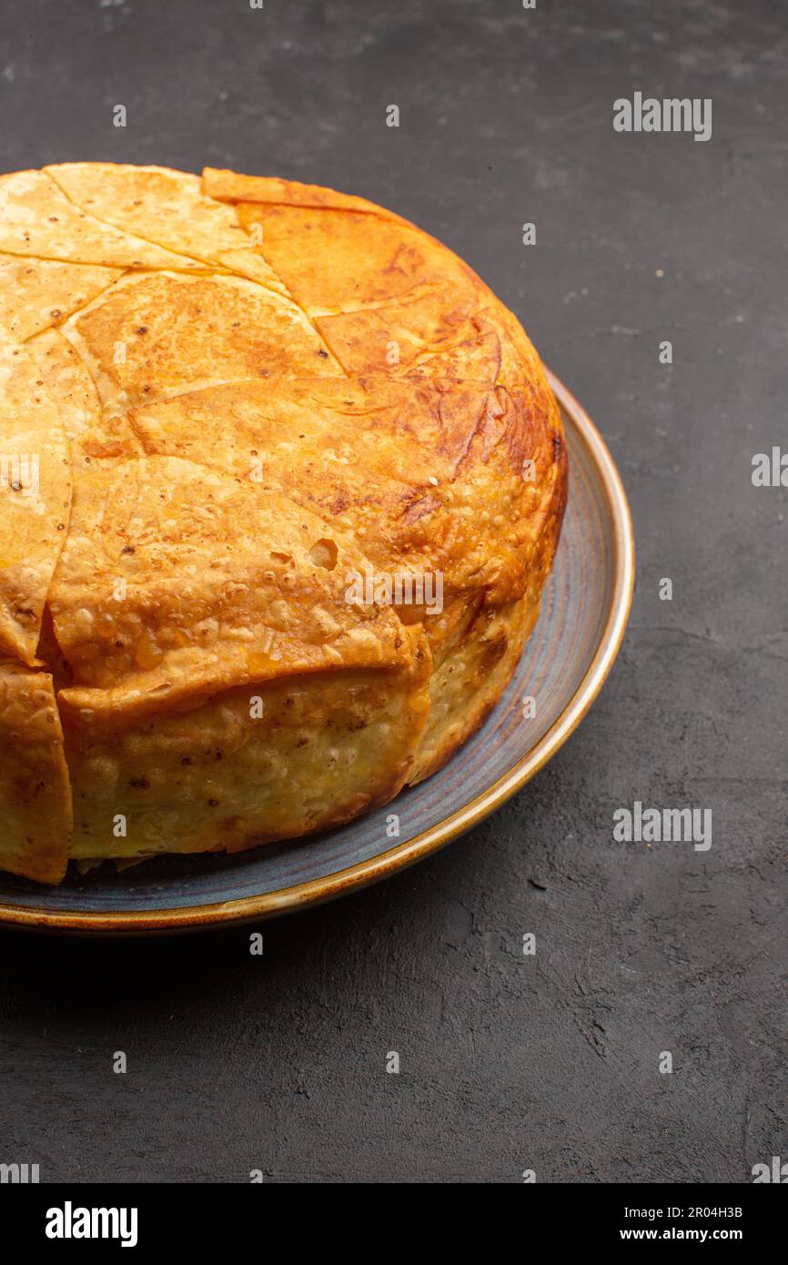 front view tasty shakh plov cooked rice inside round dough on a grey ...