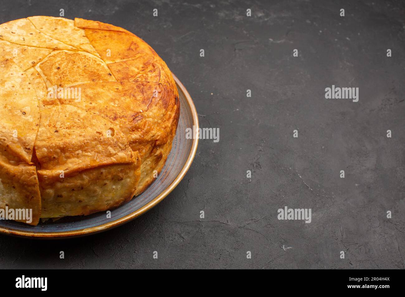 front view tasty shakh plov cooked rice inside round dough on grey ...