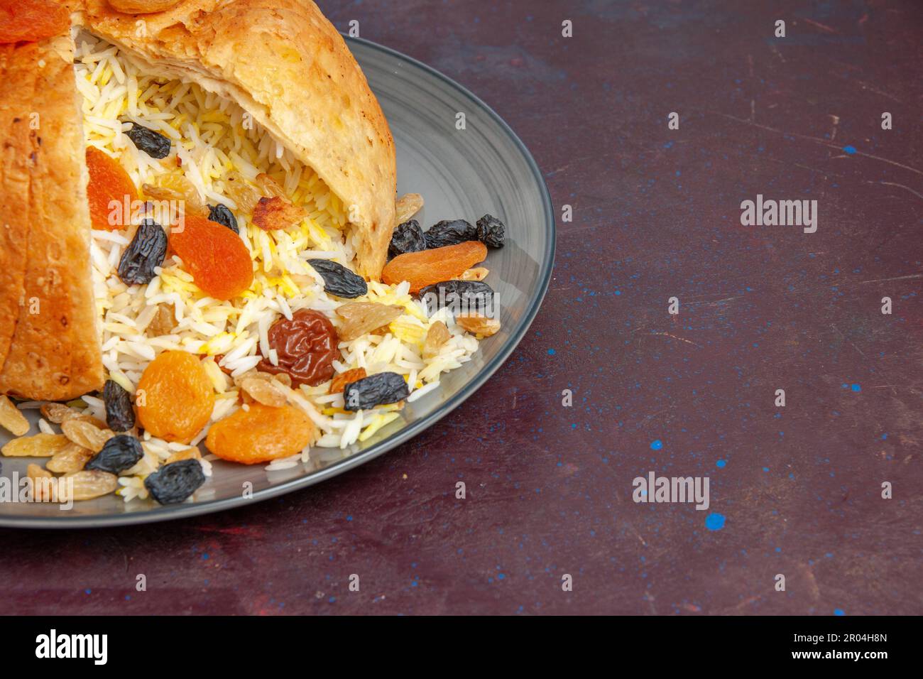 front view tasty shakh plov with raisins on dark desk cooking rice meal ...
