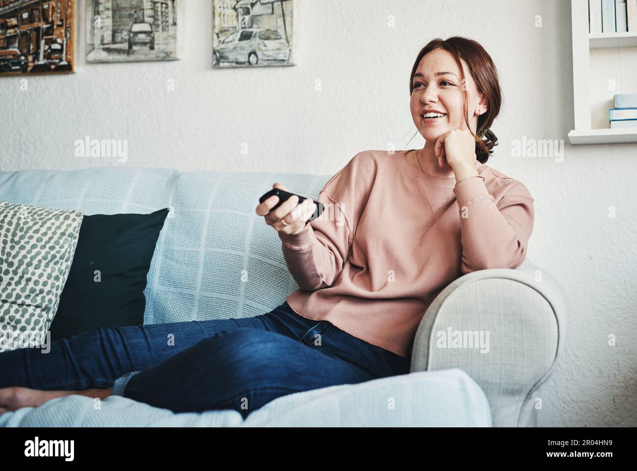 Female using remote control hi-res stock photography and images - Alamy