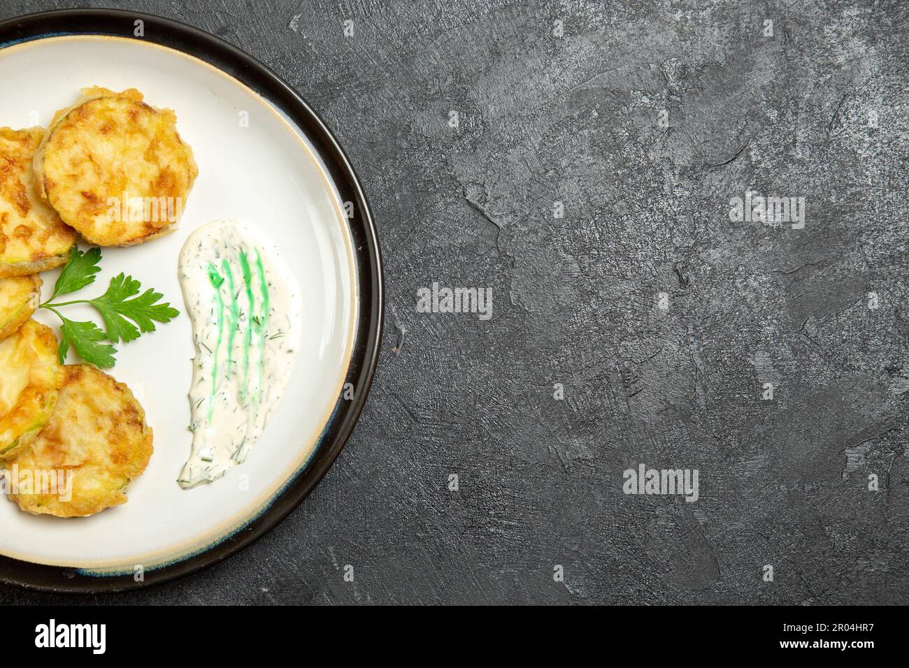 top view cooked squashes slices inside plate on a grey background ...