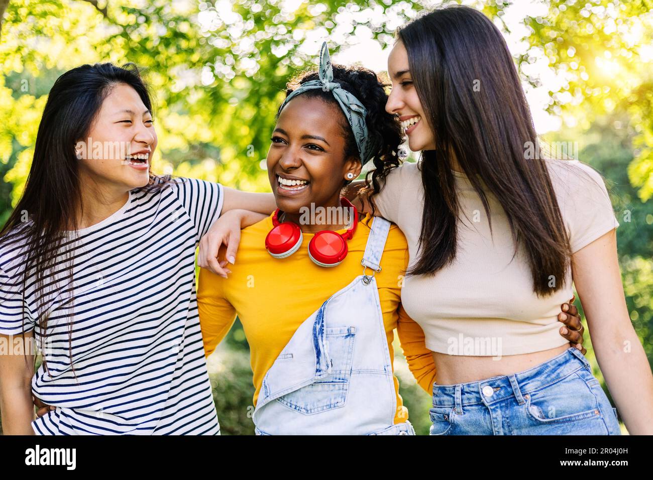 Young group of three multiracial women having fun together outdoors ...