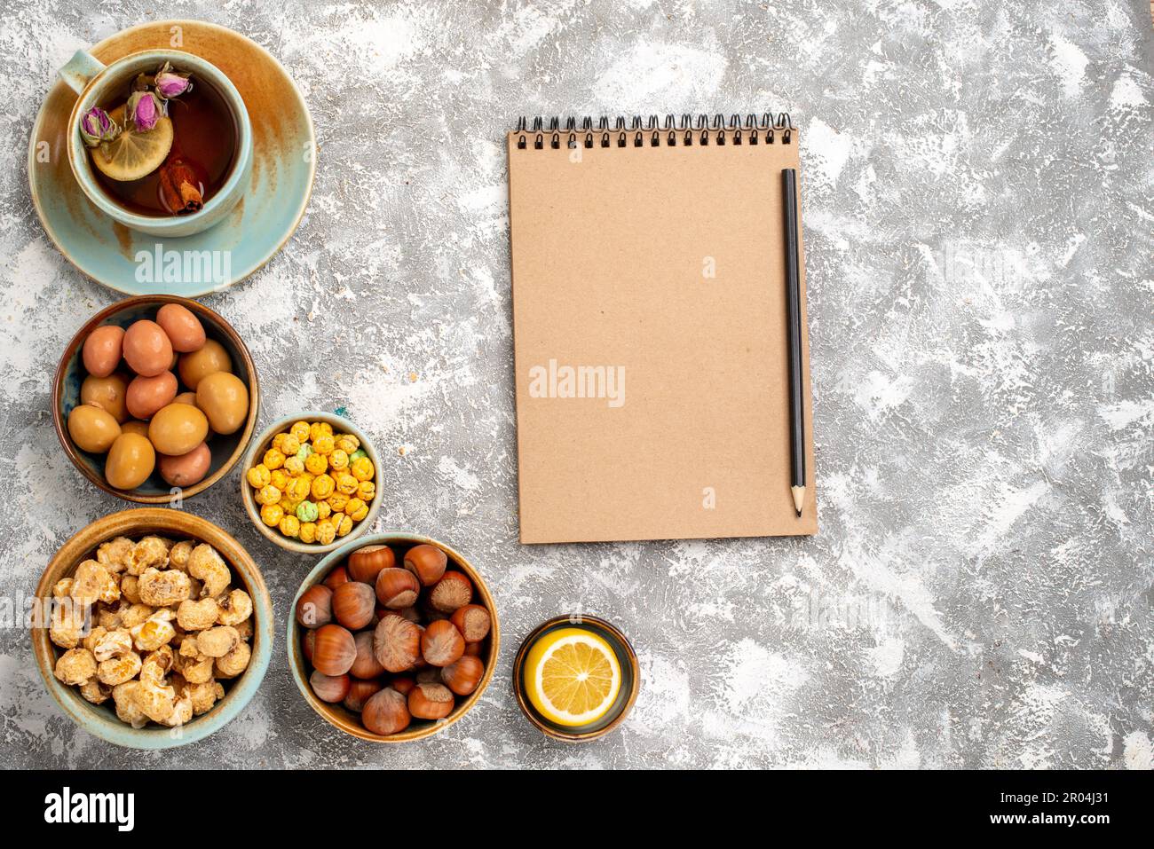 top view cup of tea with nuts and candies on a white background nut tea ...