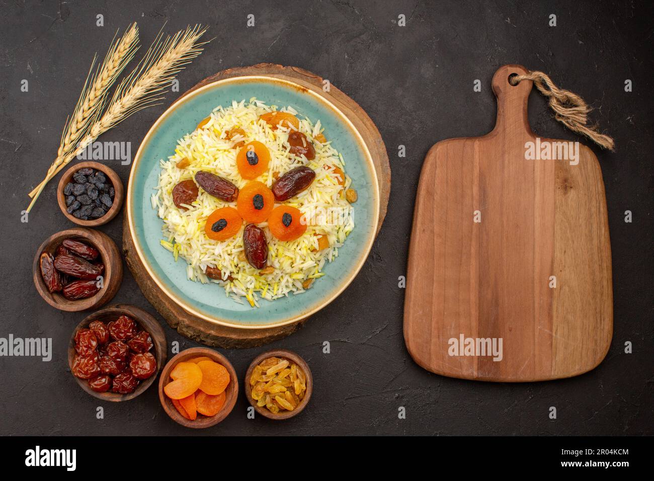 top view delicious cooked plov rice with different raisins inside plate ...