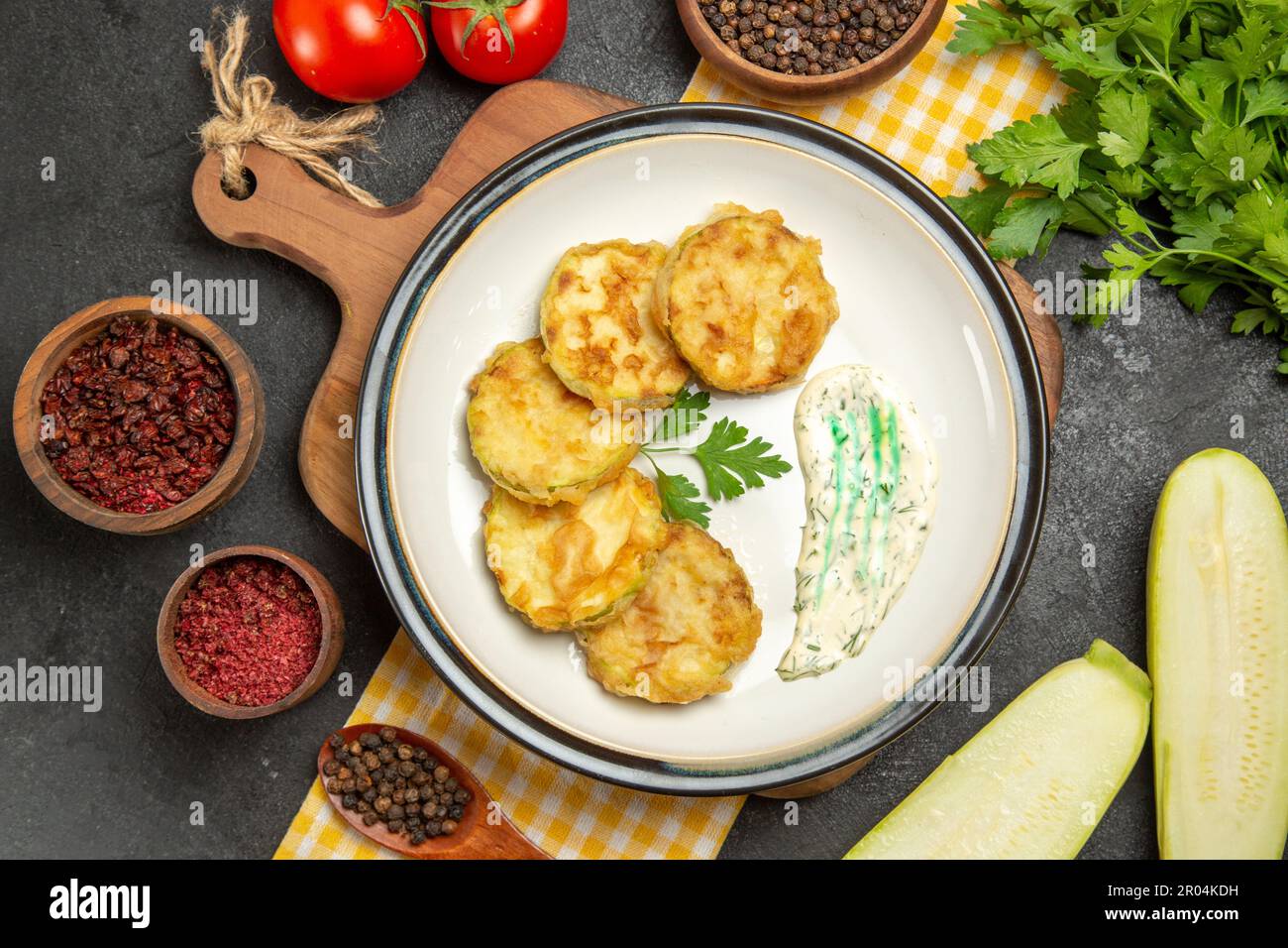 top view delicious cooked squashes with seasonings and tomatoes on grey ...