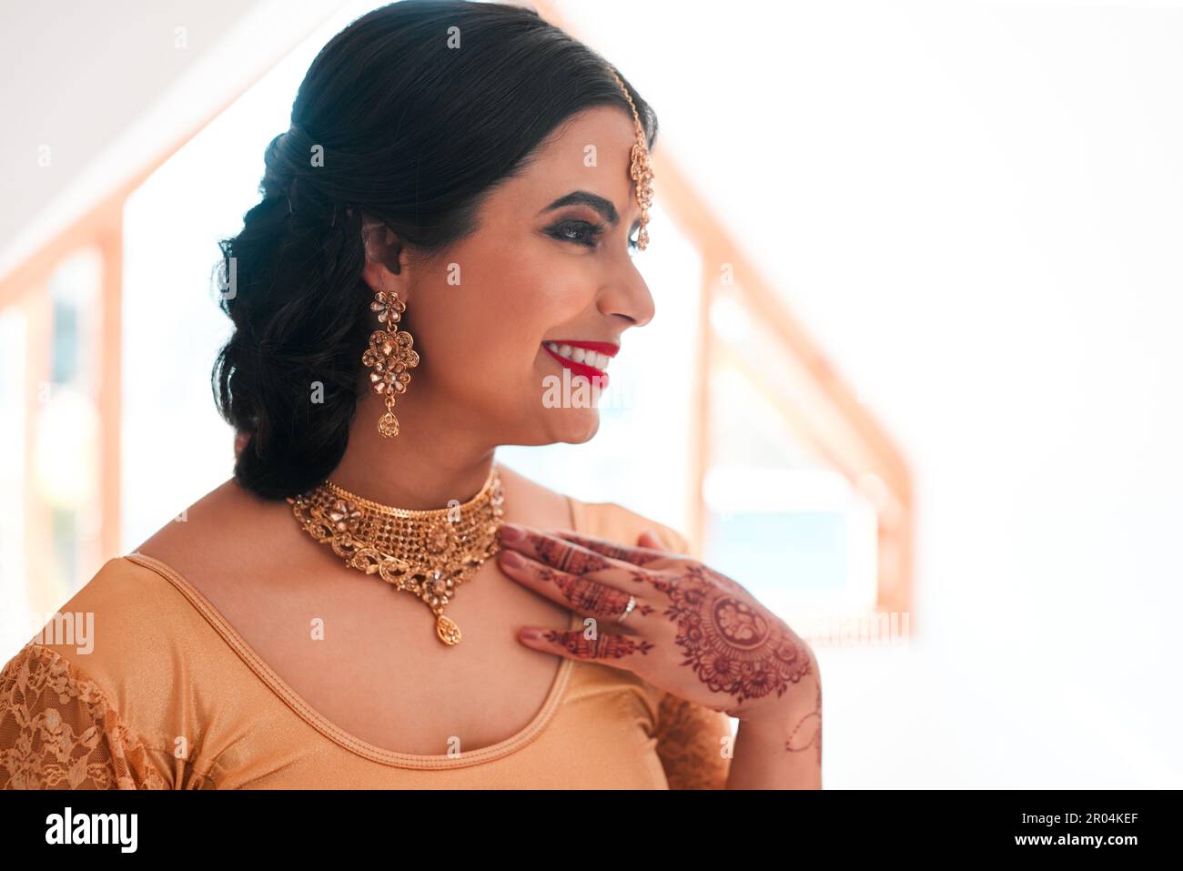 Bridal style to swoon over. a beautiful young woman getting ready for ...