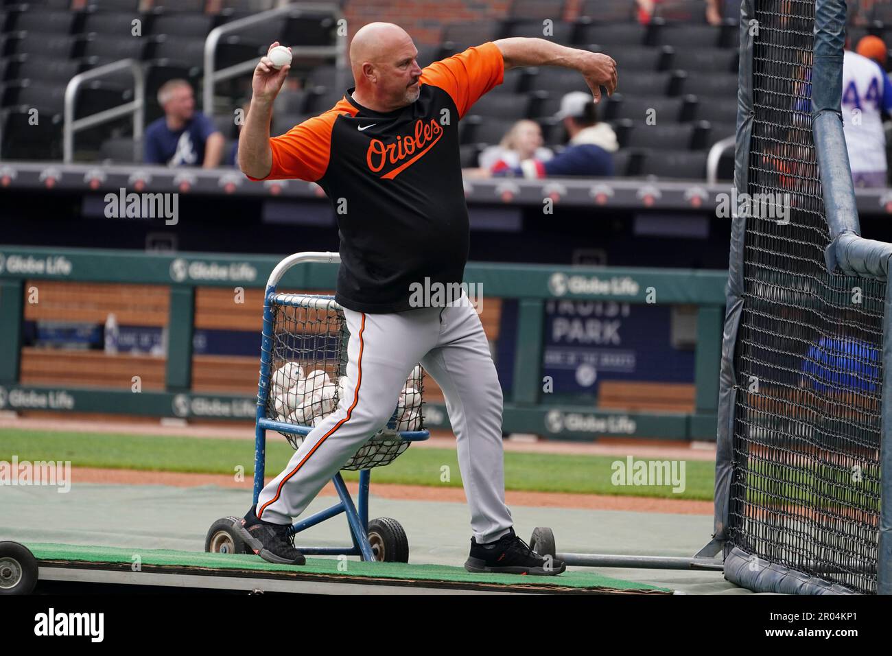 Baltimore Orioles bench coach Fredi González (57) throws during batting ...