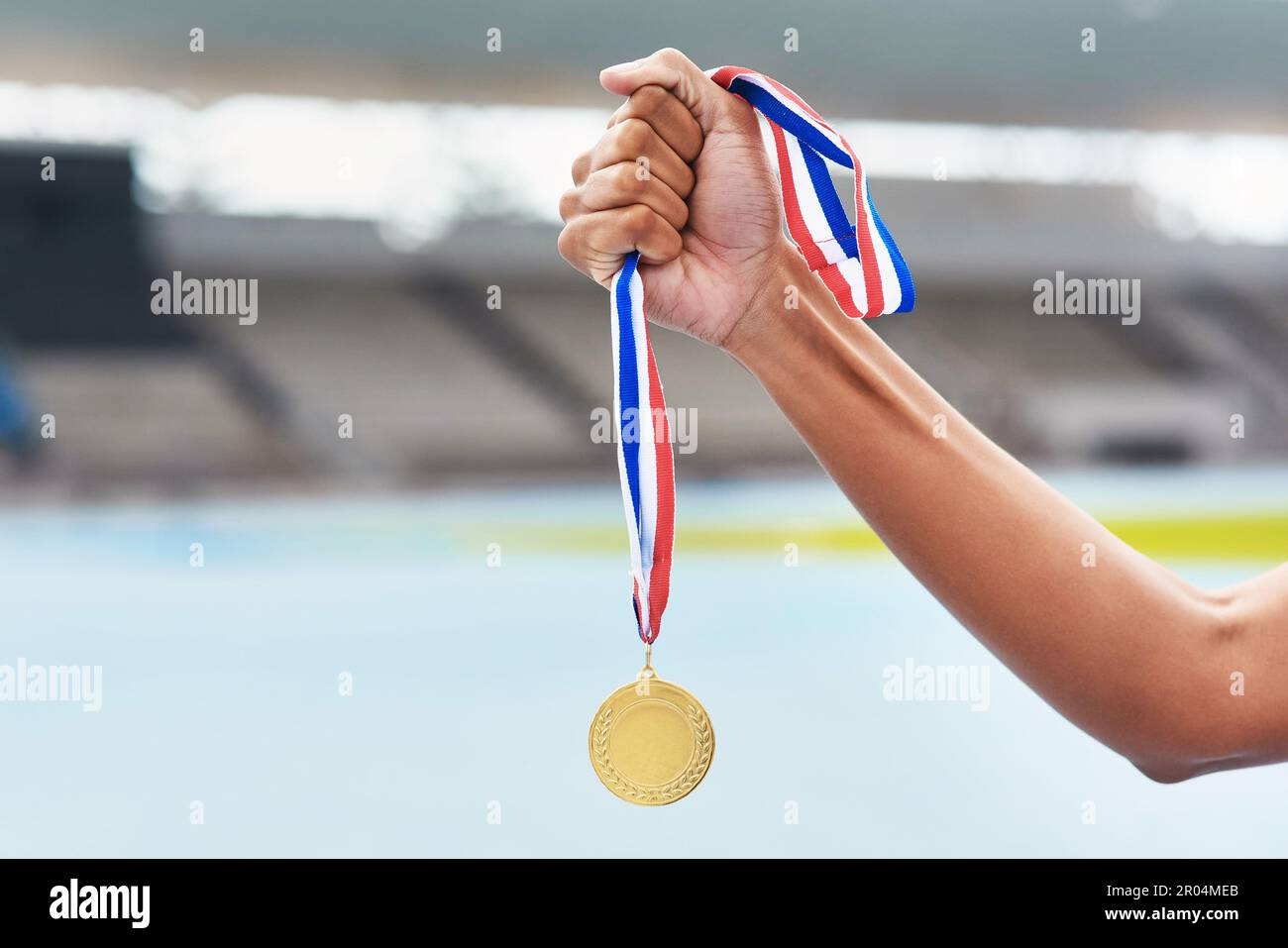 Only winners get their hands on the gold. an unrecognizable young woman ...