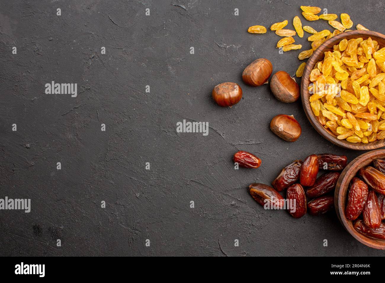 top view different tasty raisins from grape and other fruits on the ...