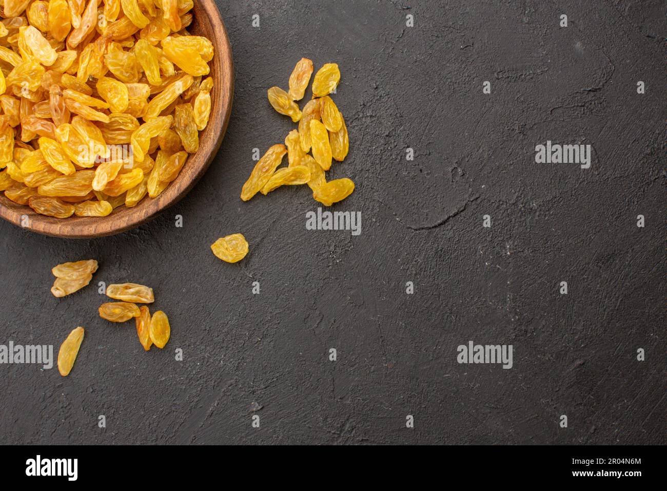 top view dried grape raisins inside plate on a grey background dry ...