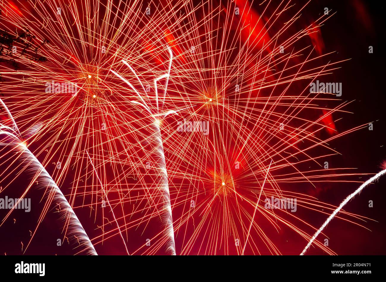 Festive New Year's fireworks. Bright beams of bursting fireworks ...