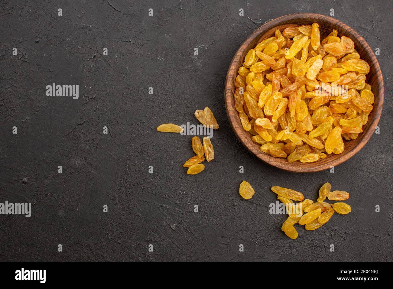 top view dried grape raisins inside plate on the grey background dry ...