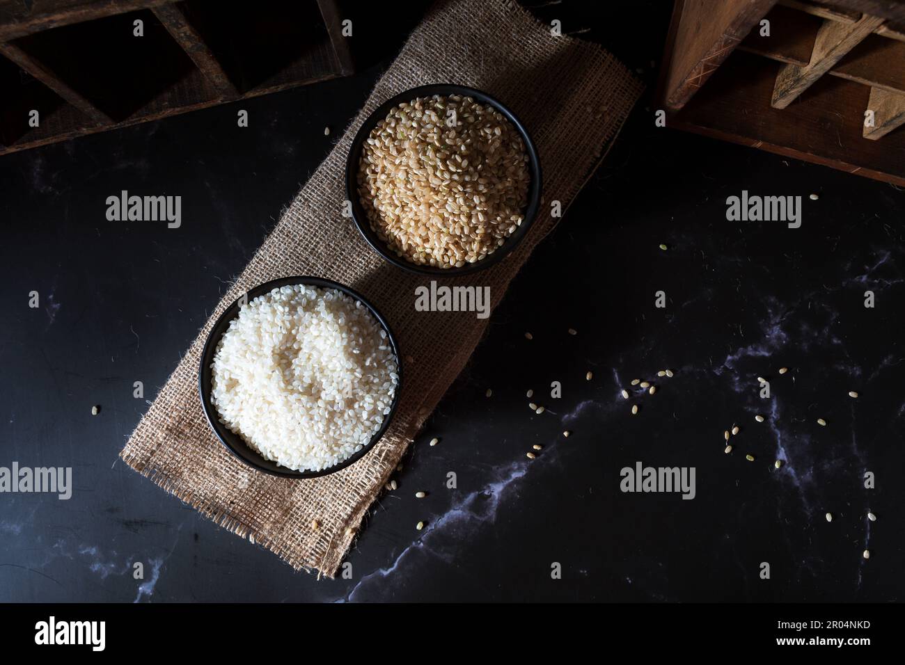 Top of two black bowls with white yamani rice and brown yamani rice ...