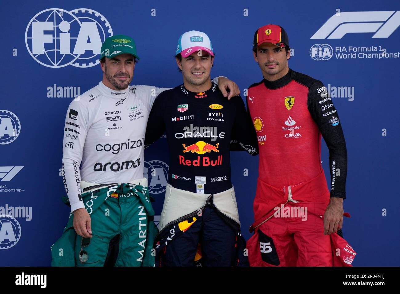 First-place finisher Red Bull driver Sergio Perez, center, of Mexico ...