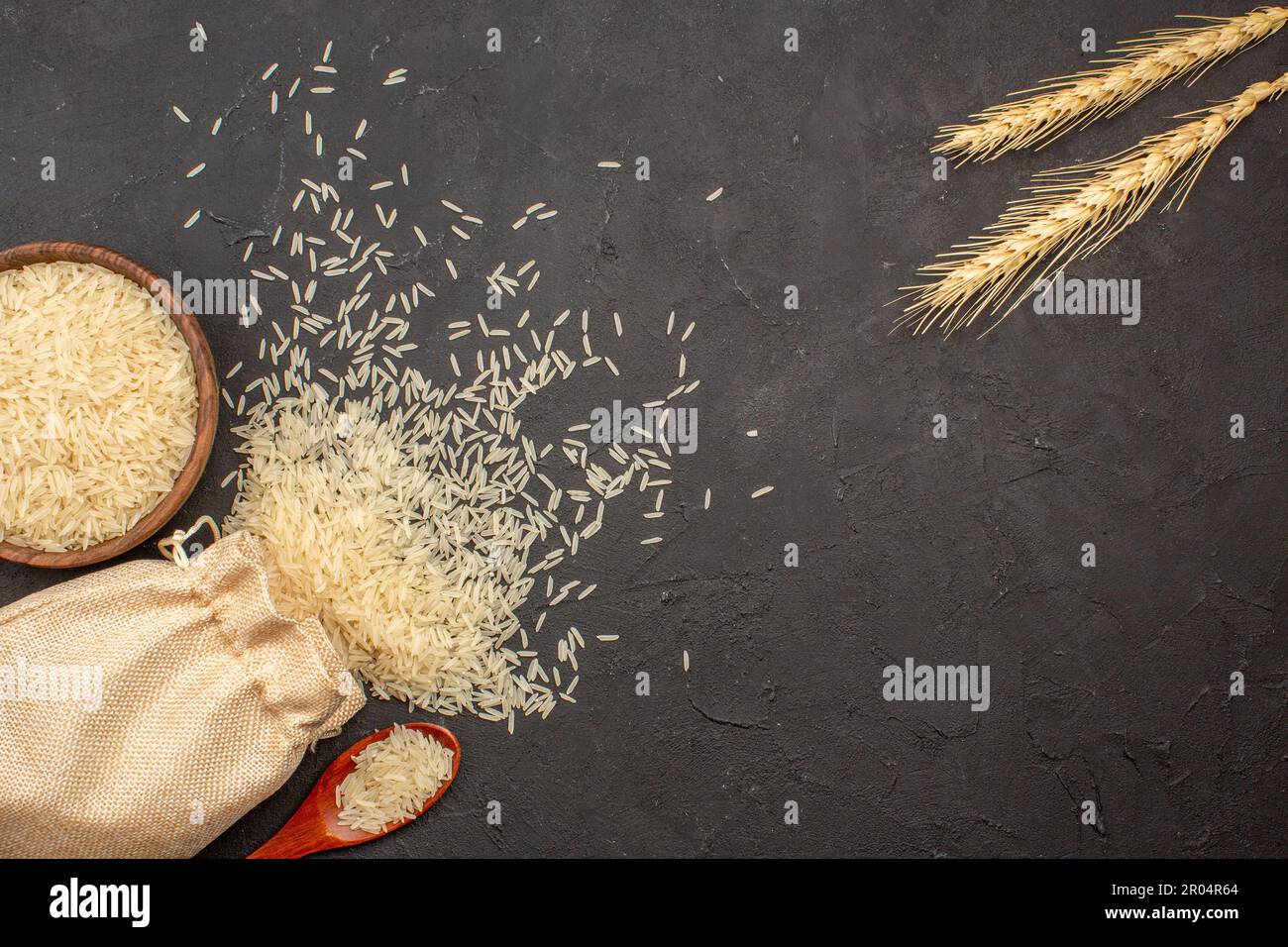 top view raw rice inside bag and plate on grey background rice raw food ...