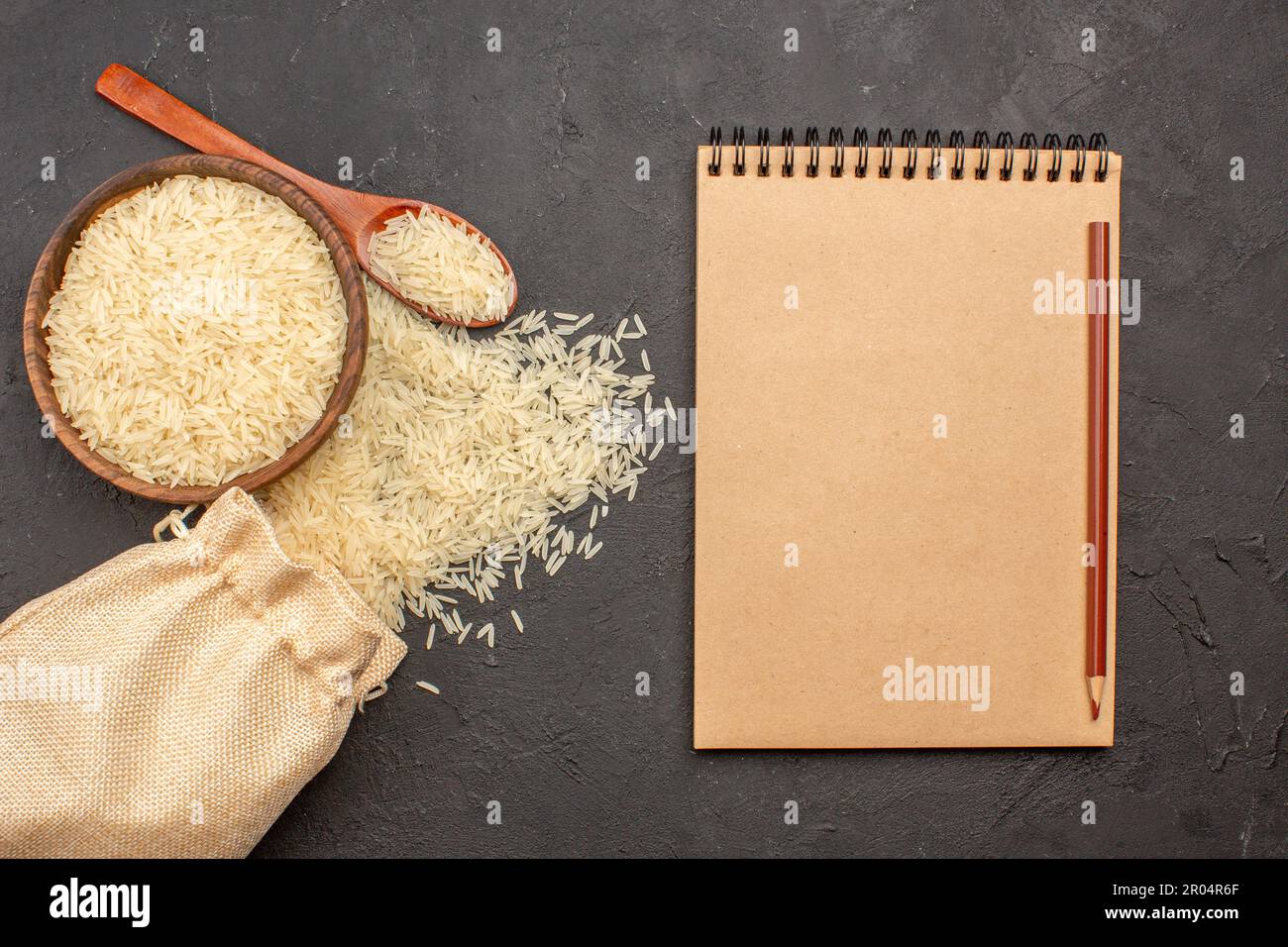 top view raw rice inside brown plate on a grey background rice raw food ...