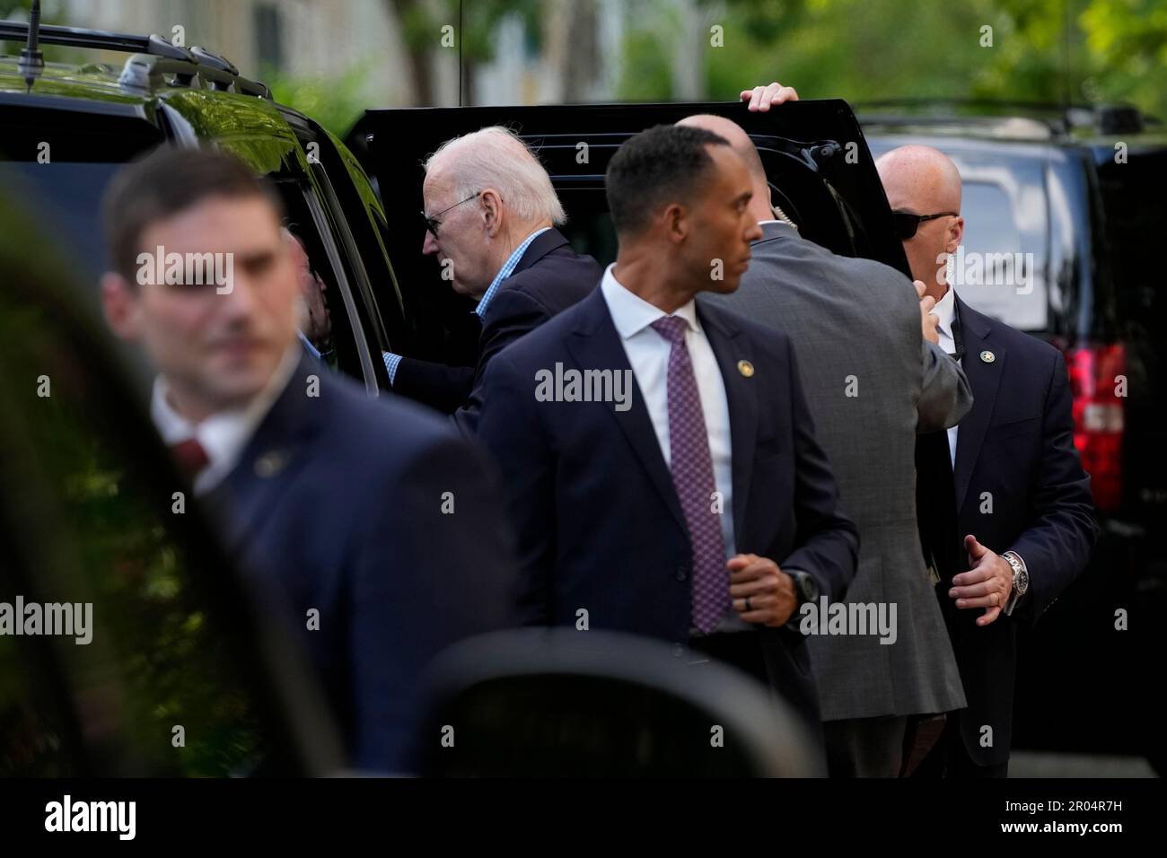 President Joe Biden steps into a motorcade vehicle after attending Mass ...