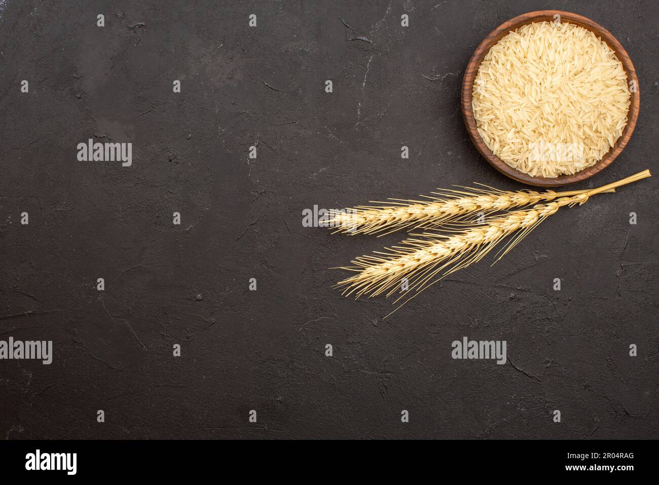 top view raw rice inside plate on grey background rice raw food granule ...