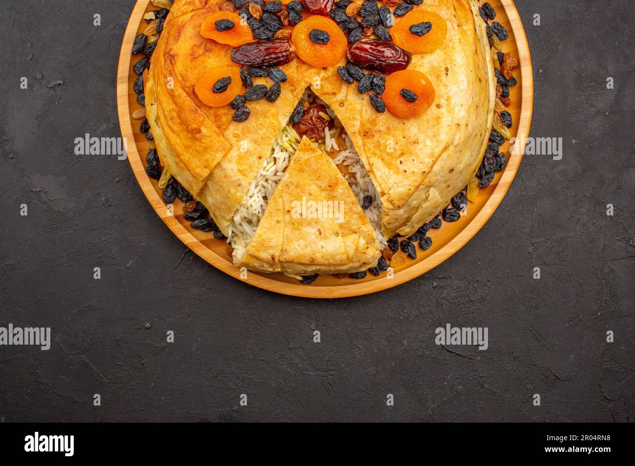 top view shakh plov delicious rice meal cooked inside round dough with ...