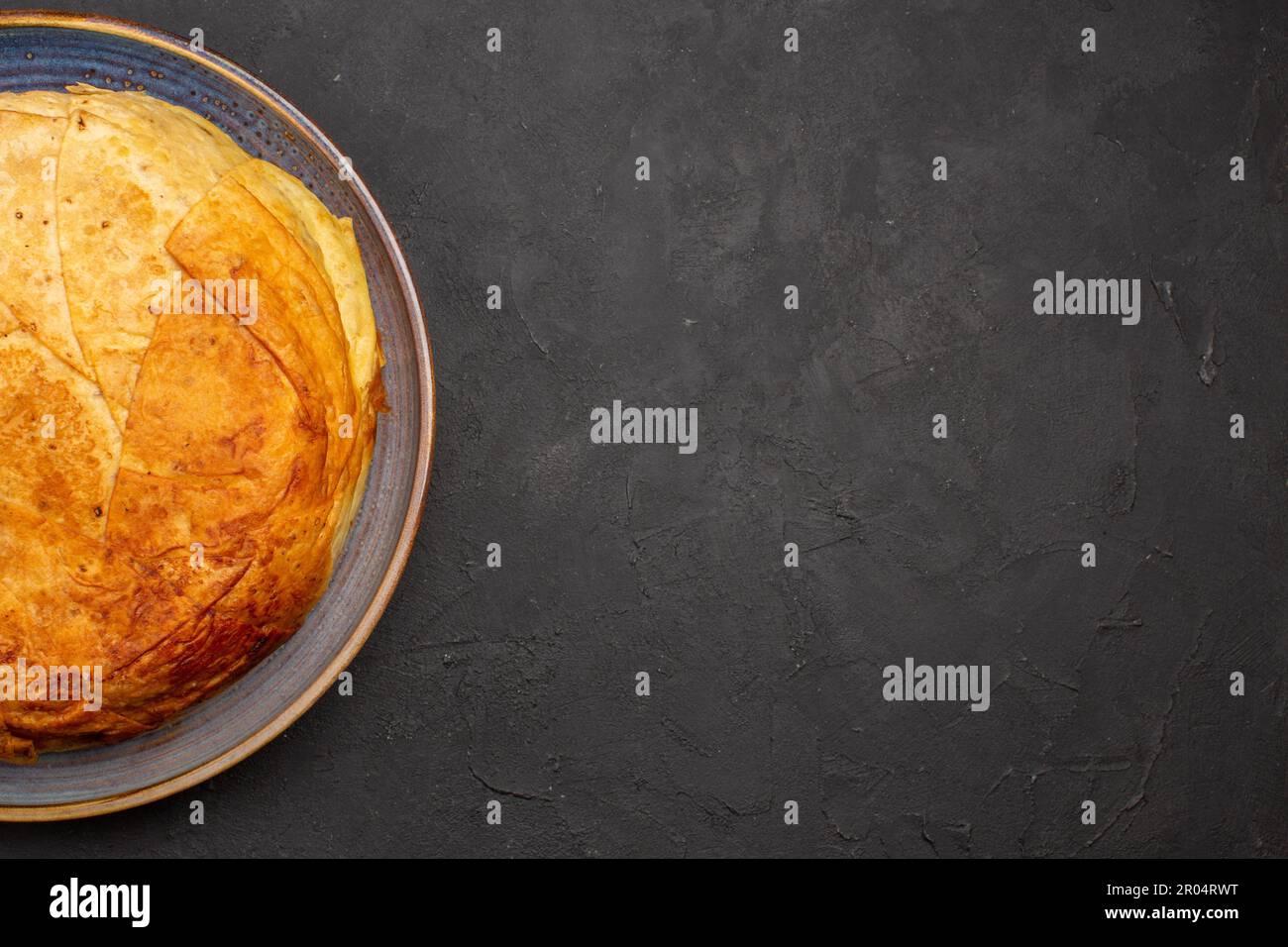 top view tasty shakh plov cooked rice inside round dough on grey desk ...