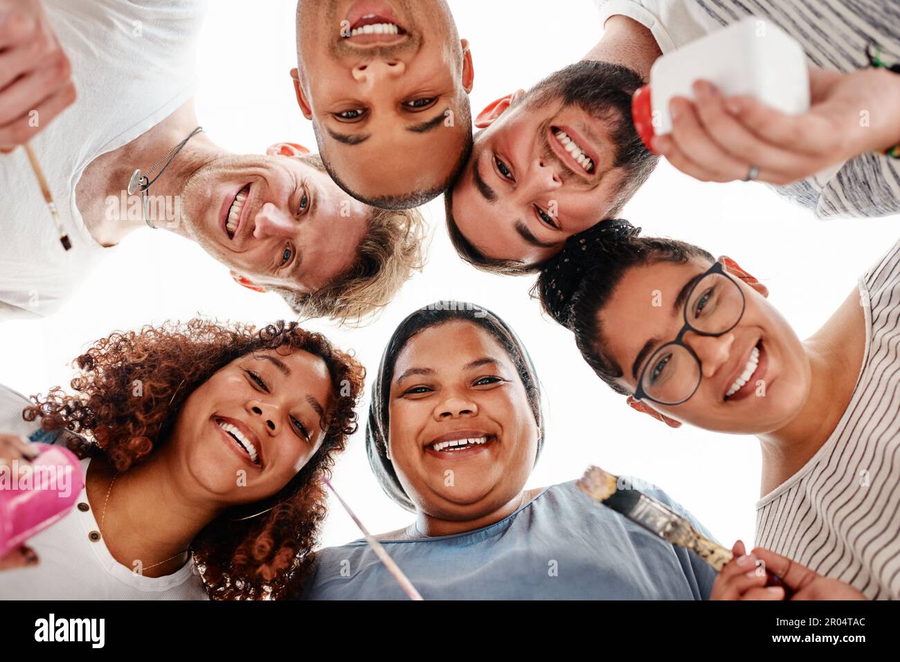 Art creates unity. Low angle portrait of a diverse group of friends ...