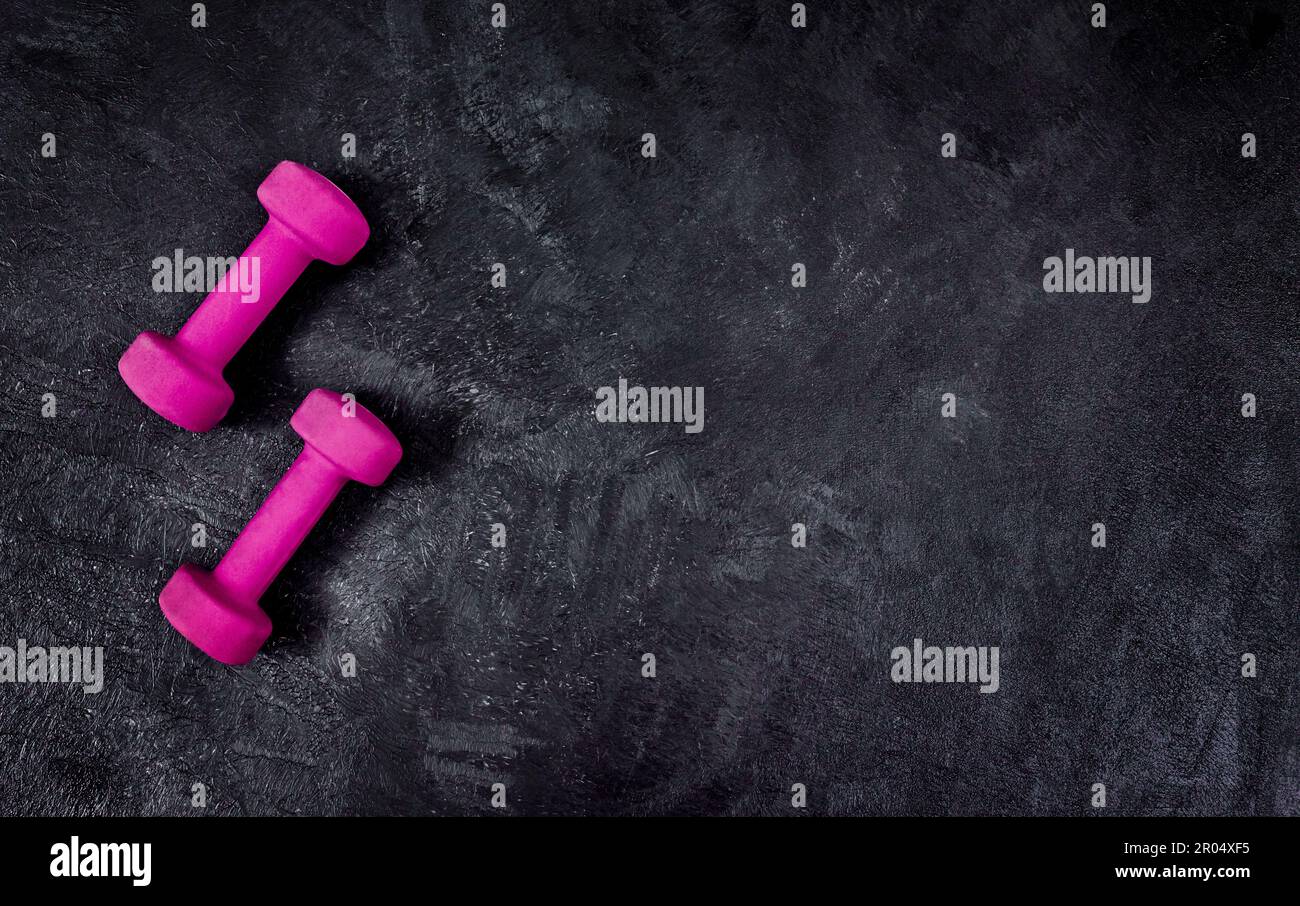 Were pretty light weight. High angle shot of two lightweight dumbbells ...