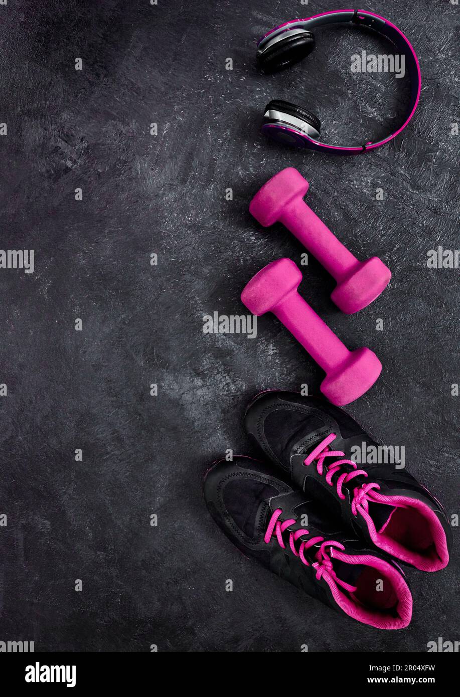 Pretty in pink. High angle shot of a group of workout essentials lying ...