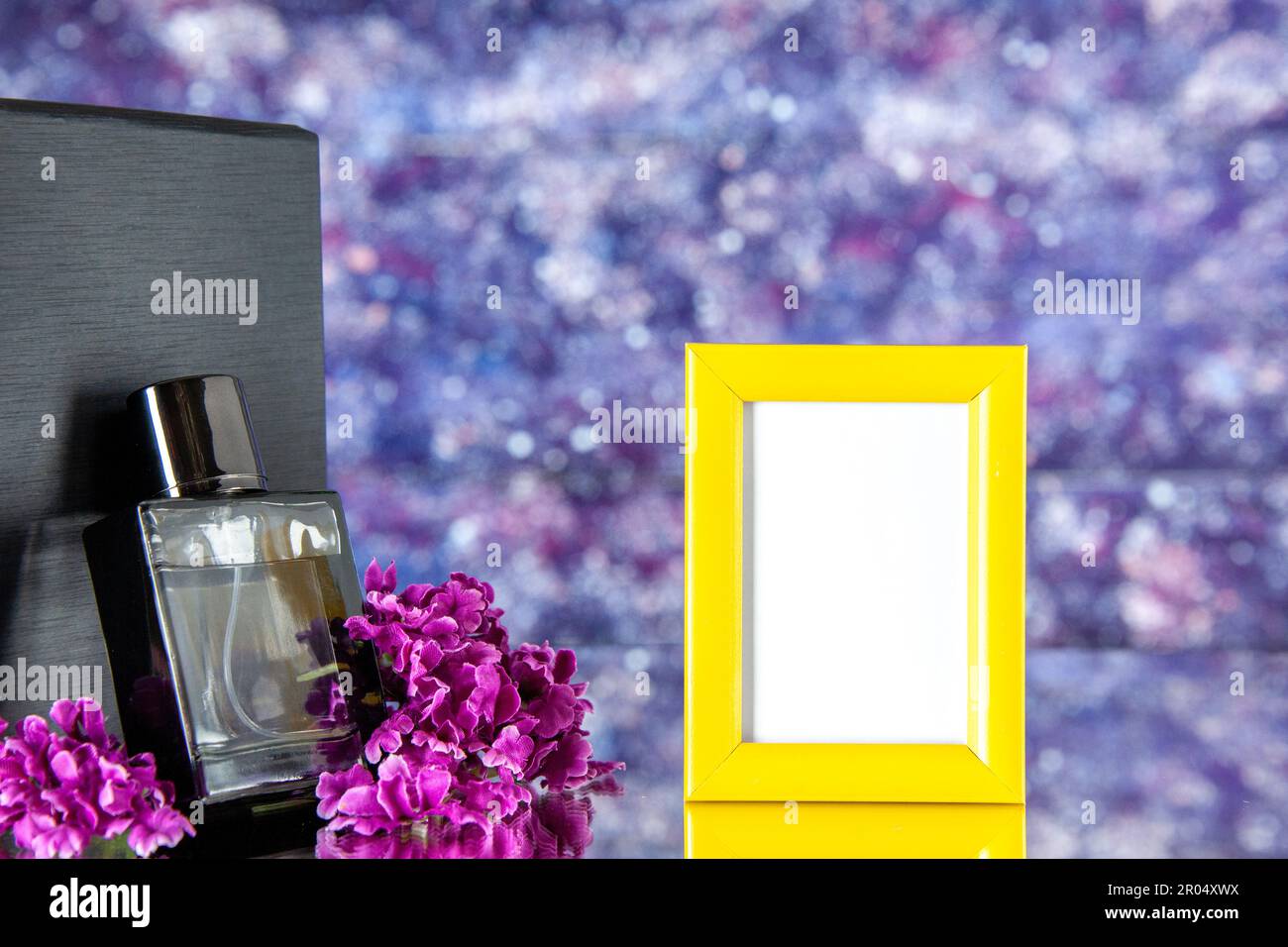 front view black fragnance with yellow picture frame on bright ...