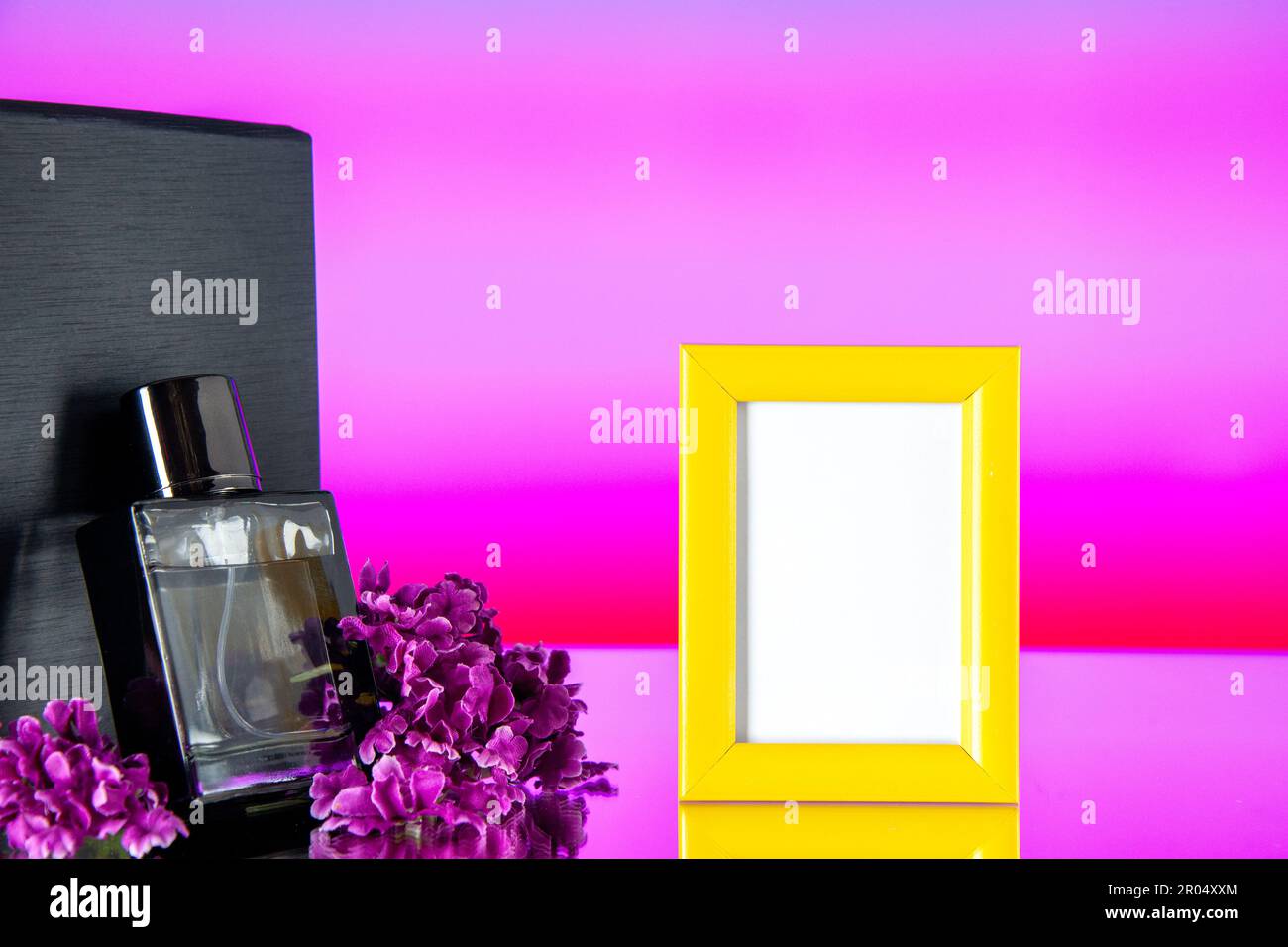 front view black fragnance with yellow picture frame on light ...