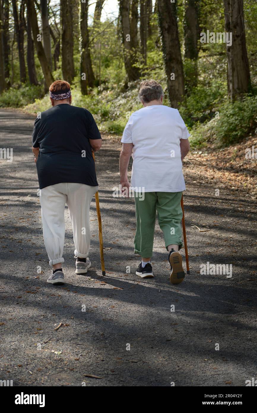 Two senior woman walk along the public Virginia Creeper Trail in ...