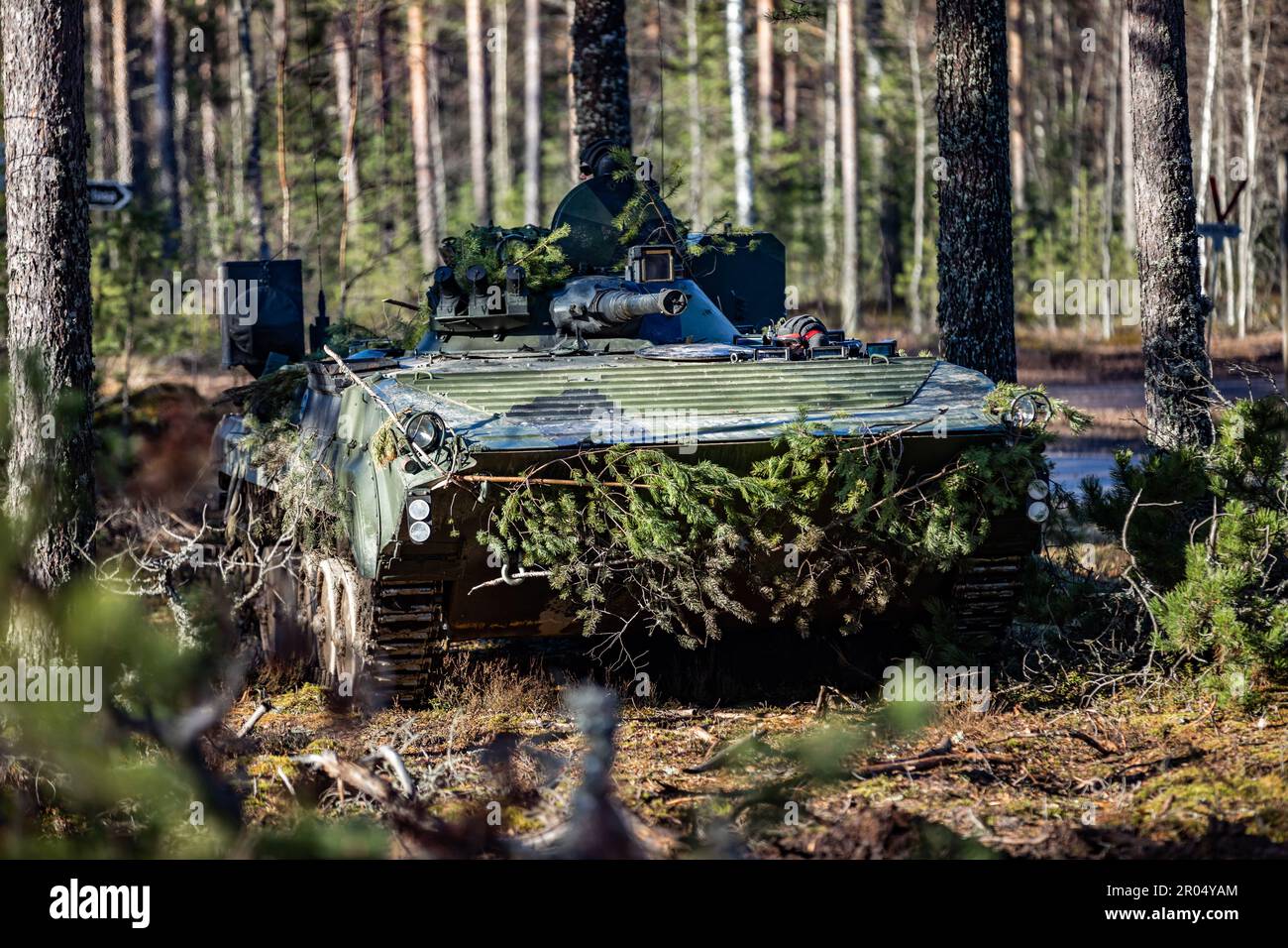 Finnish soldiers assigned to the Finnish Armoured Brigade maneuver an ...