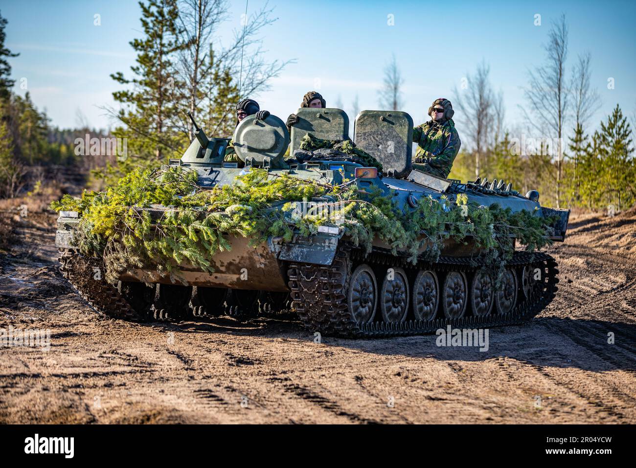 Finnish soldiers assigned to the Finnish Armoured Brigade maneuver an ...