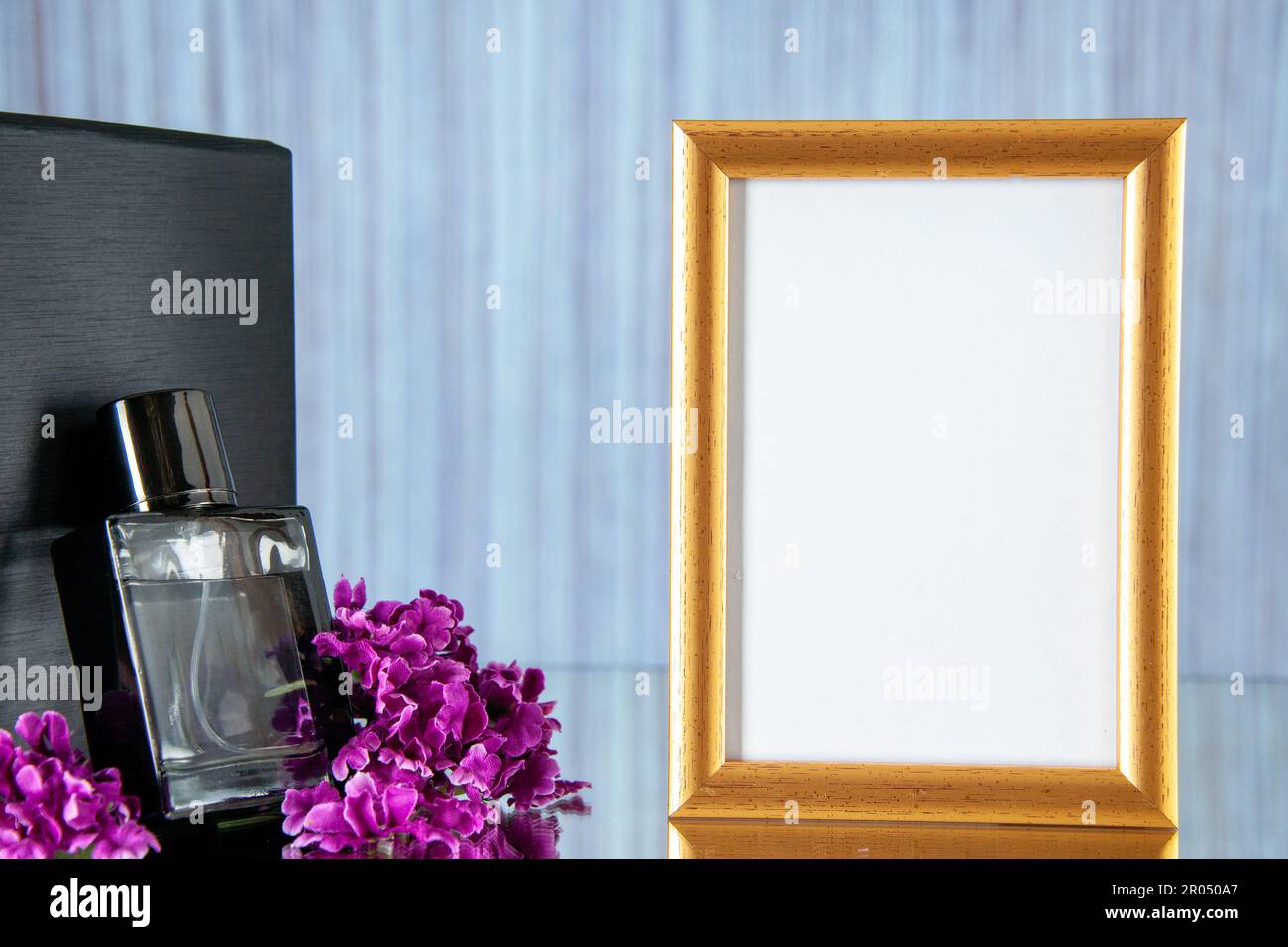 front view expensive fragnance with picture frame on the light ...